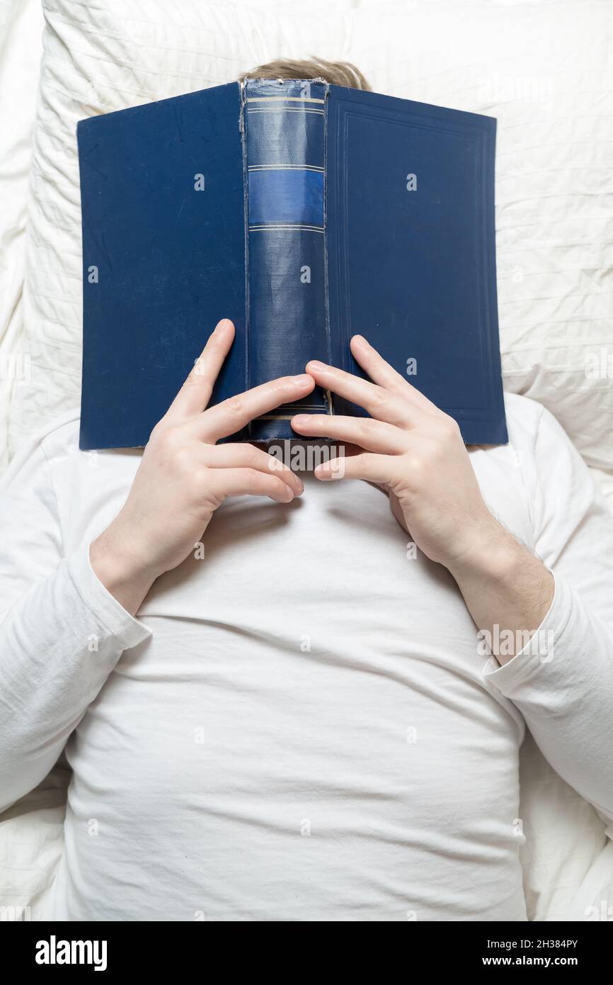 Man sleeping book on face hi-res stock photography and images - Alamy