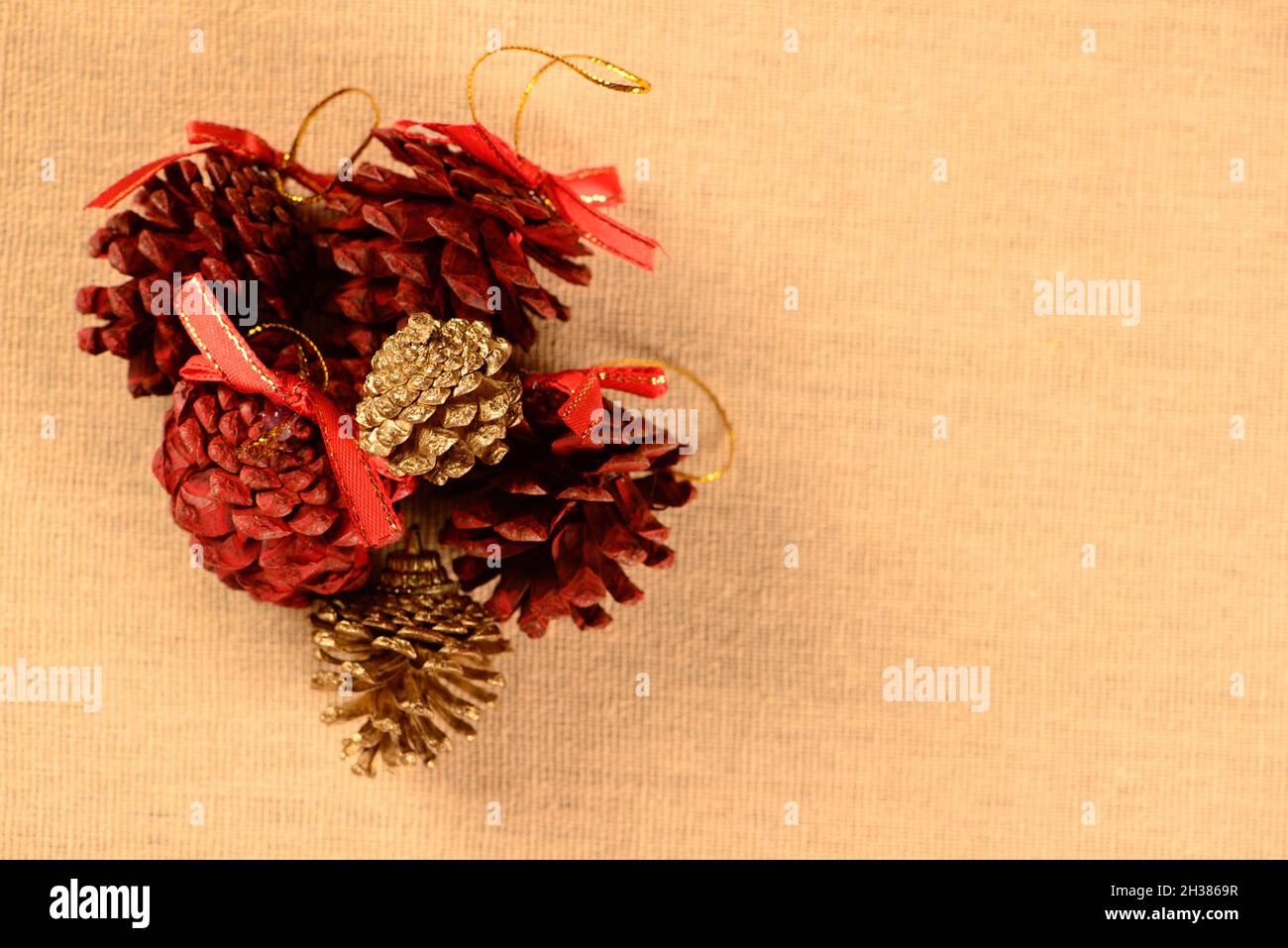 small red and gold pine cones on cotton fabric Stock Photo - Alamy