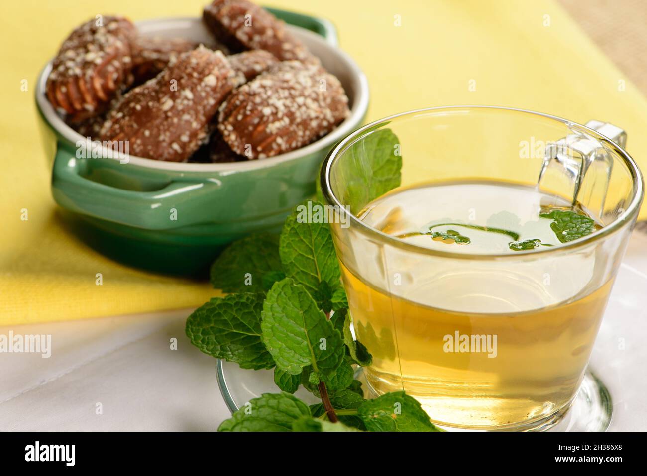 mint tea in transparent cup with sweet cookies around Stock Photo - Alamy