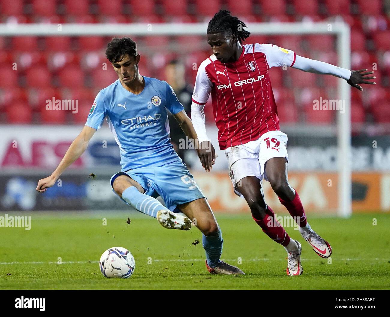 Manchester City's Finley Burns (left) and Rotherham United's Joshua ...