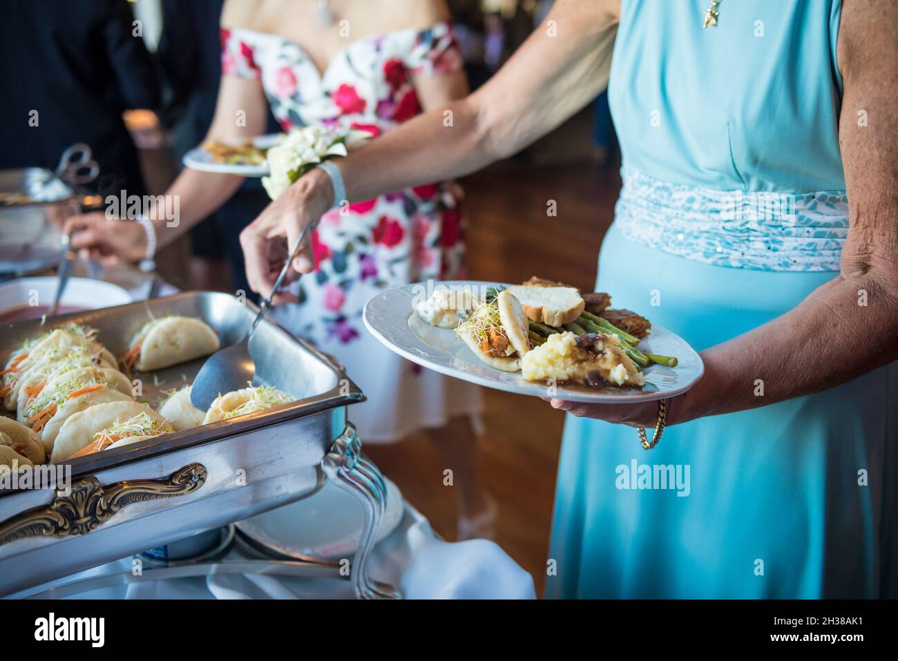 Woman putting plates on table hi-res stock photography and images - Alamy