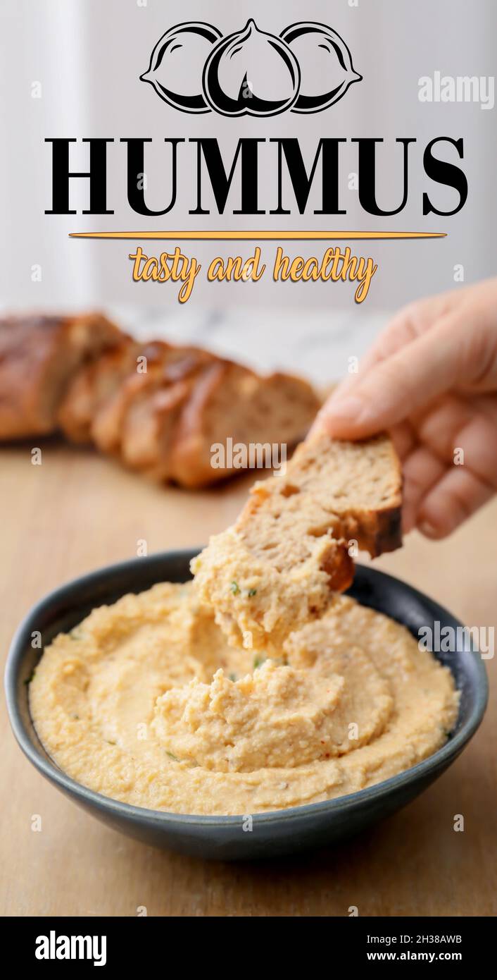 Eating of healthy humus with bread Stock Photo - Alamy