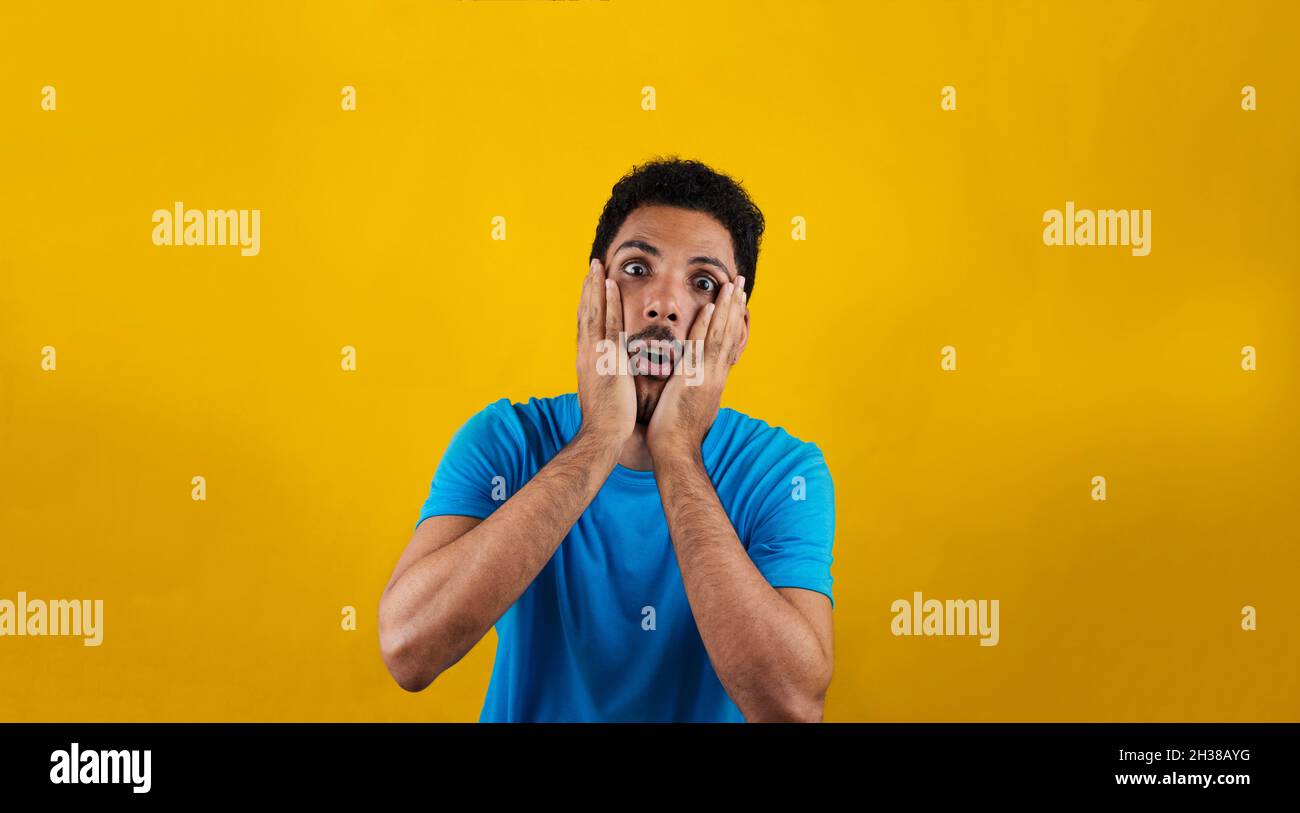 Surprise man isolated on yellow background. Handsome Black Man with ...