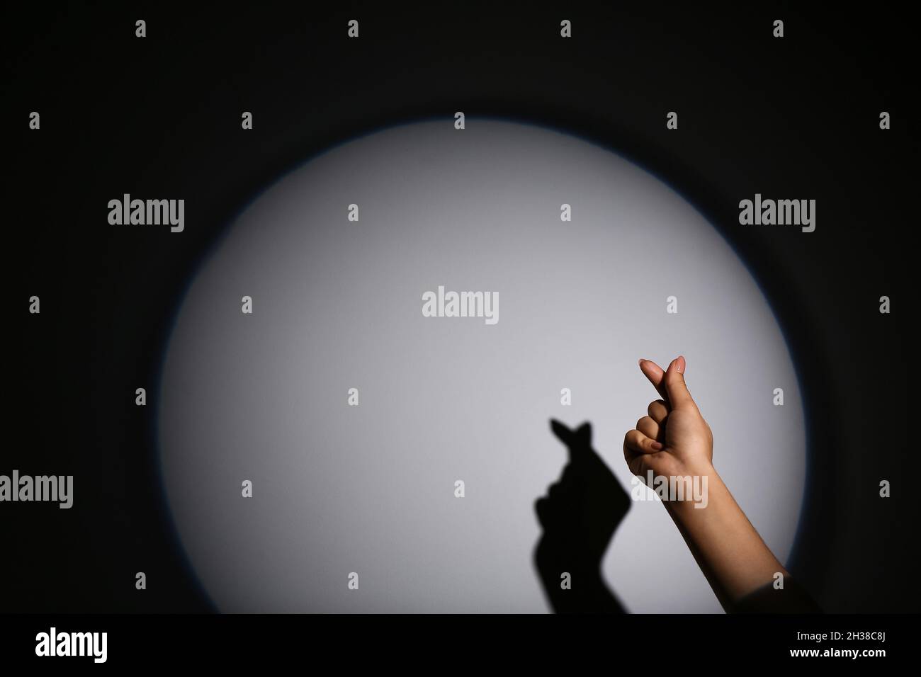 Woman performing a shadow play Stock Photo - Alamy