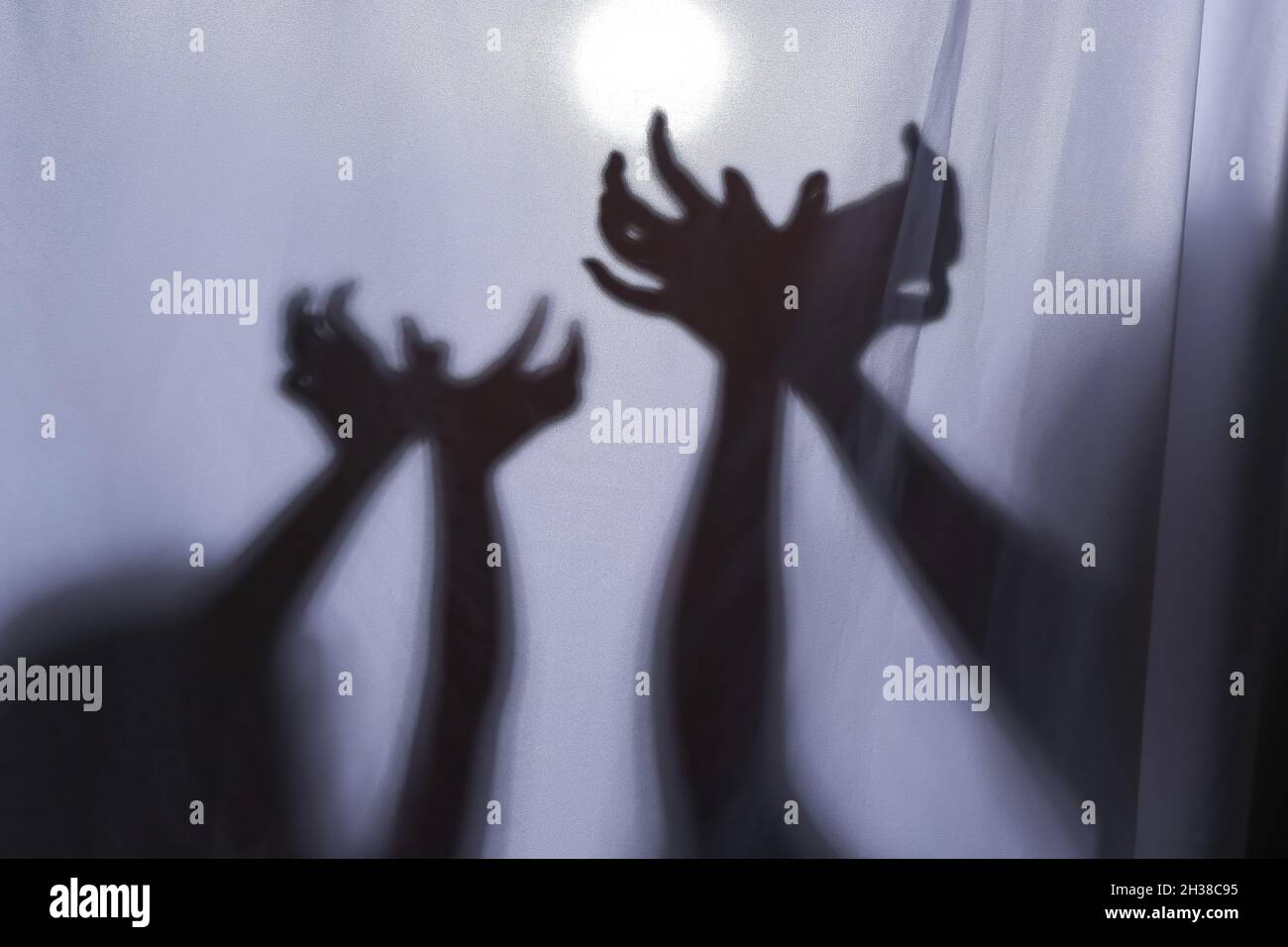 Mother and child performing a shadow play Stock Photo - Alamy
