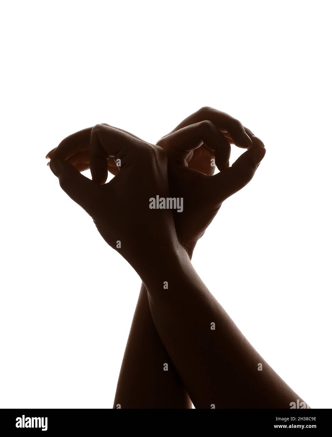 Woman performing a shadow play on white background Stock Photo - Alamy