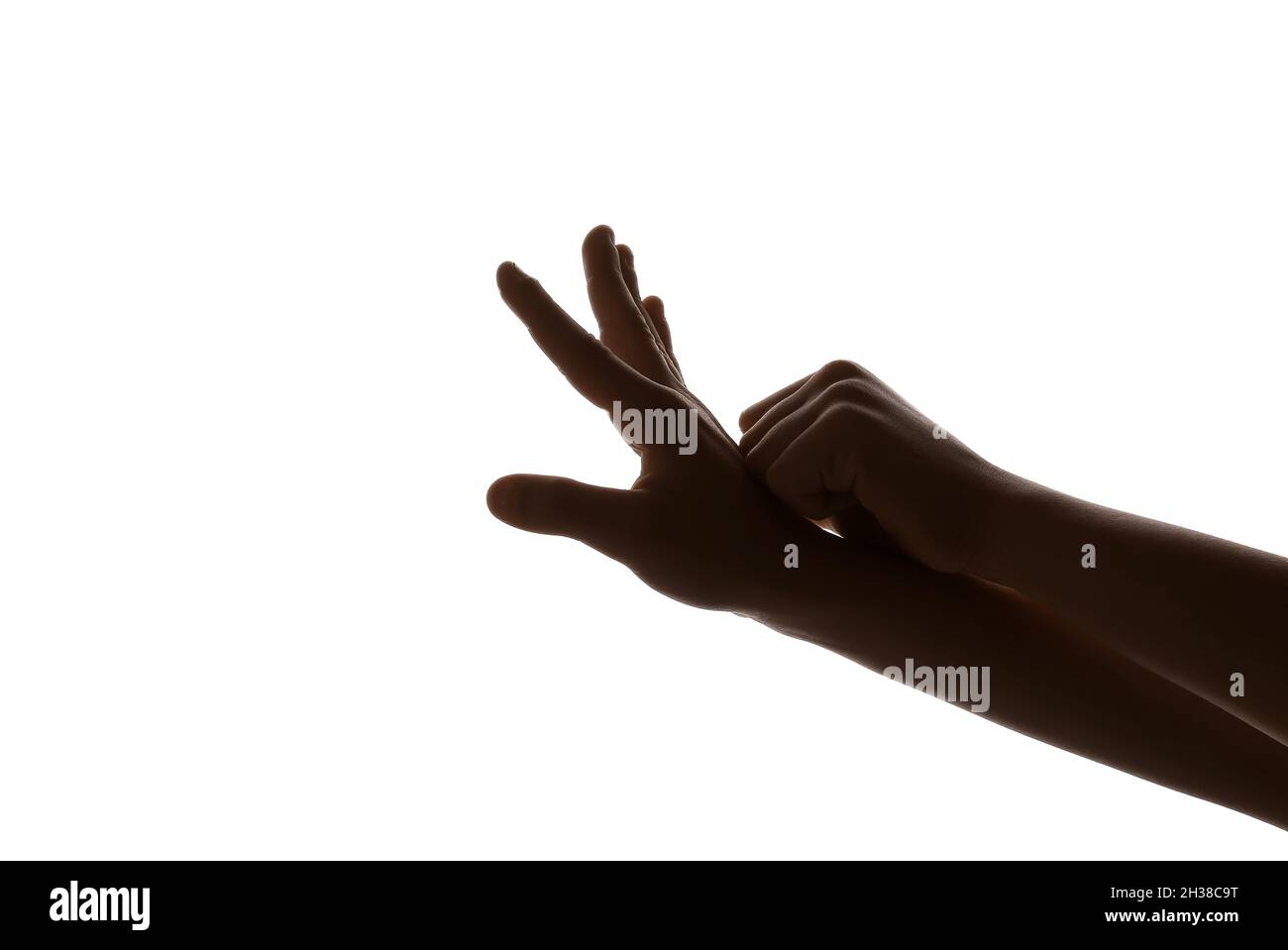 Child performing a shadow play on white background Stock Photo - Alamy