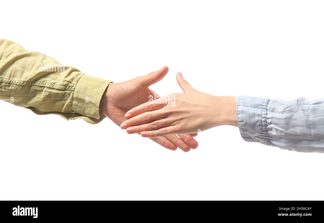 Woman and man shaking hands on white background Stock Photo - Alamy