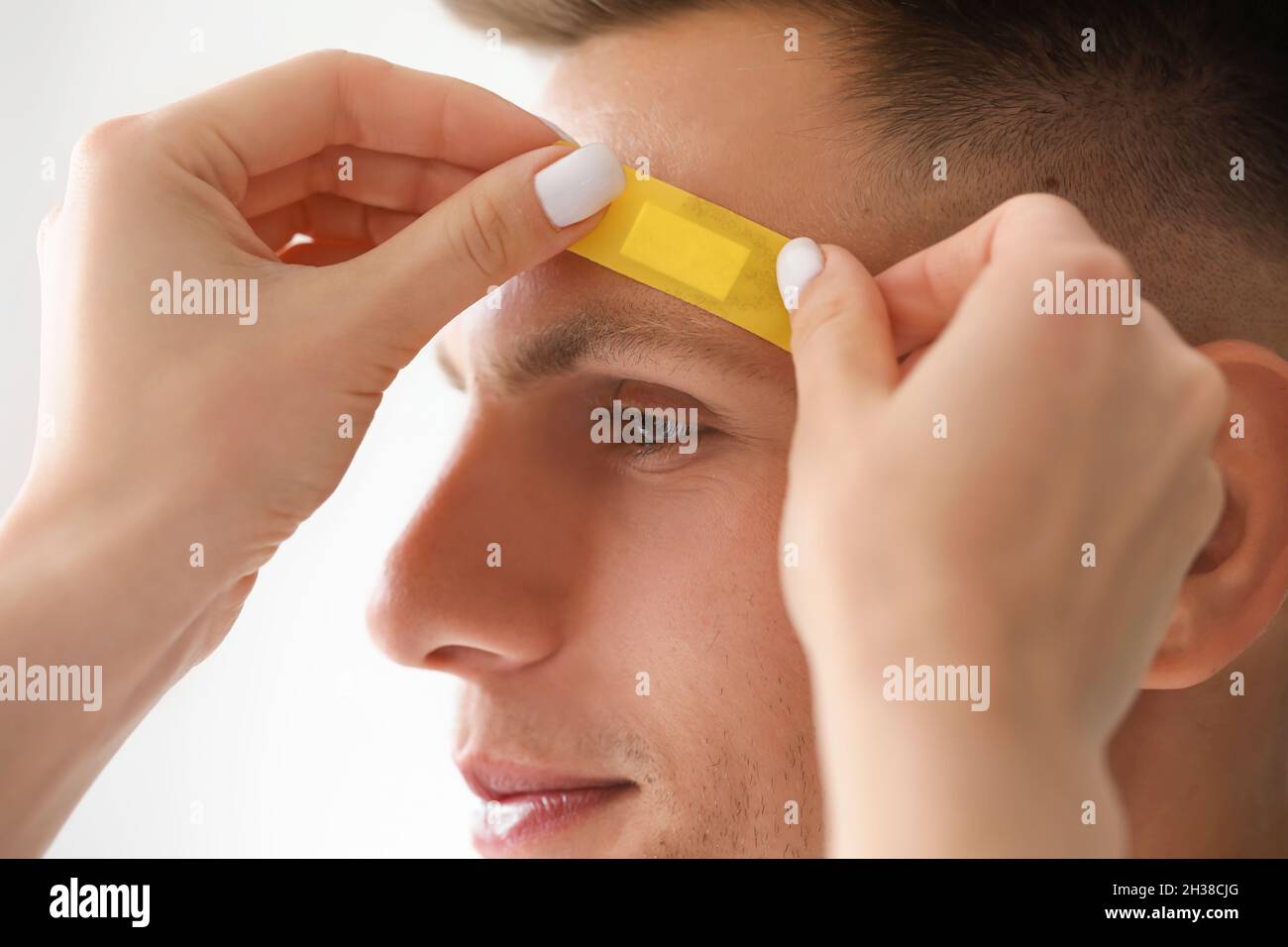 Doctor Applying Adhesive Bandage High Resolution Stock Photography and ...