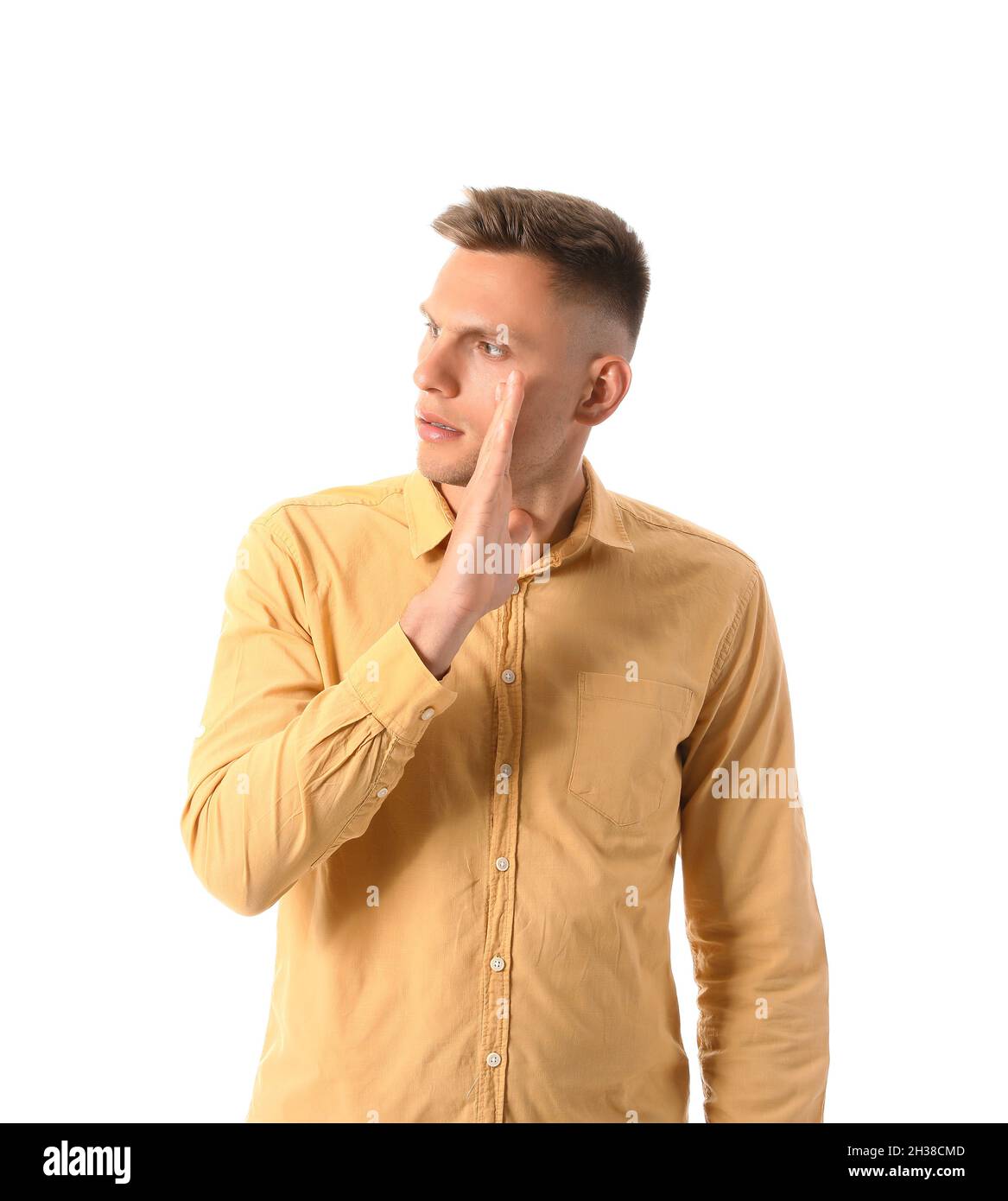 Young gossiping man on white background Stock Photo - Alamy