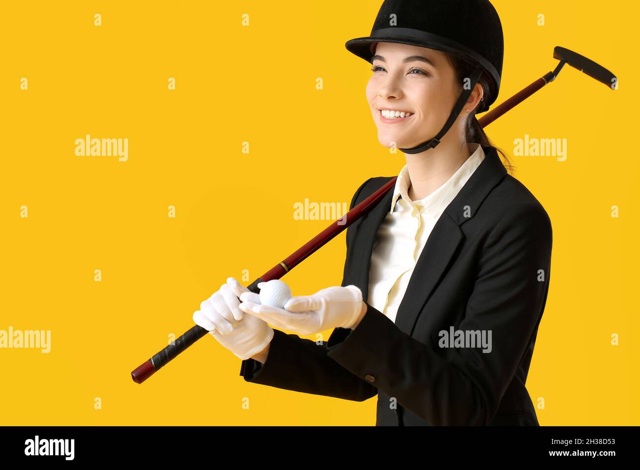 Beautiful female polo player on color background Stock Photo - Alamy