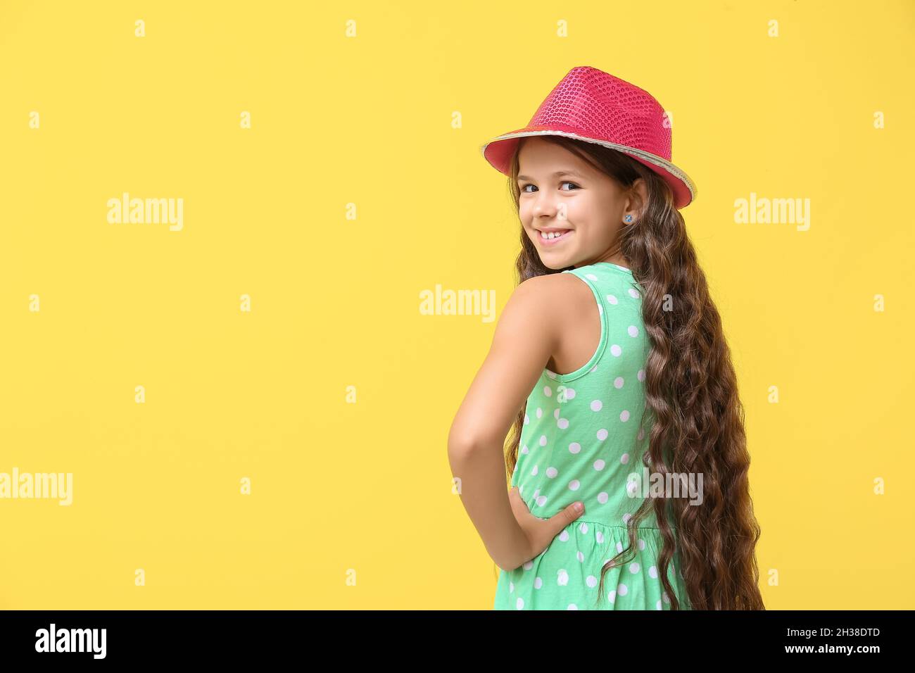 Cool stylish little girl on color background Stock Photo - Alamy