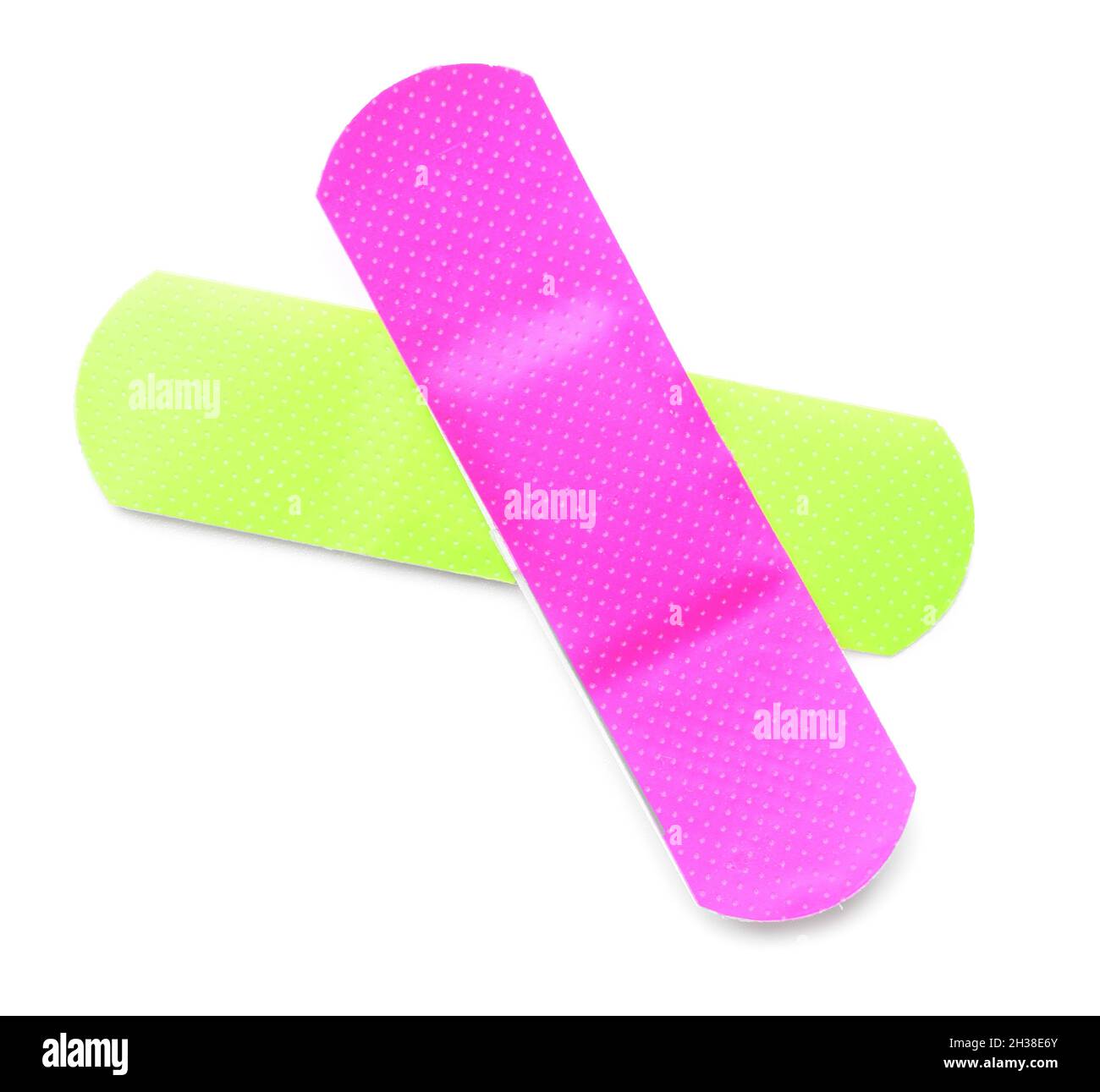 Green and pink medical plasters on white background Stock Photo - Alamy