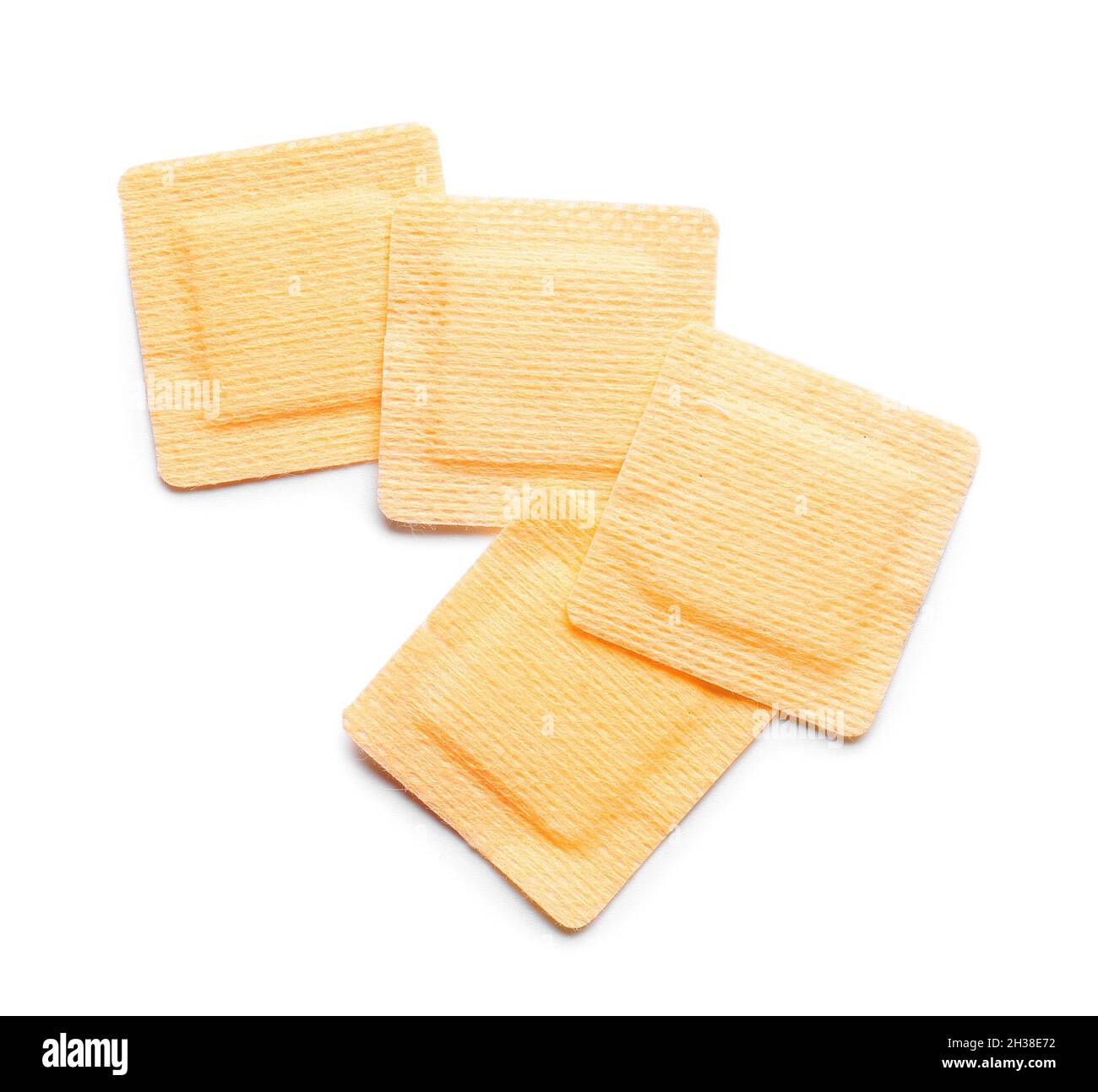 Square medical plasters on white background Stock Photo - Alamy