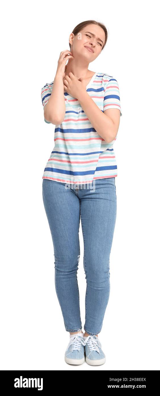 Young woman scratching herself on white background Stock Photo - Alamy