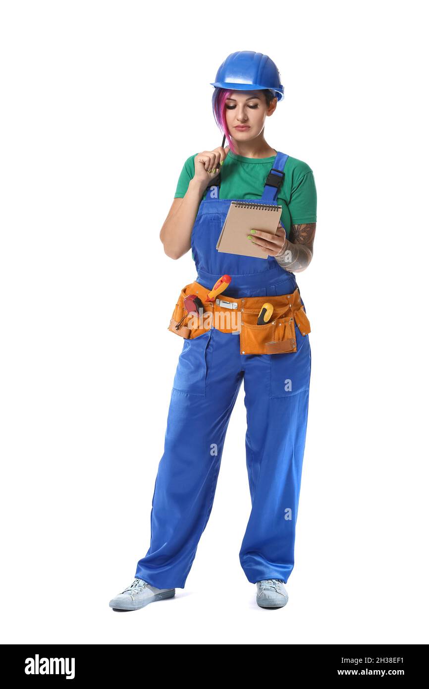 Thoughtful female electrician with notebook on white background Stock ...