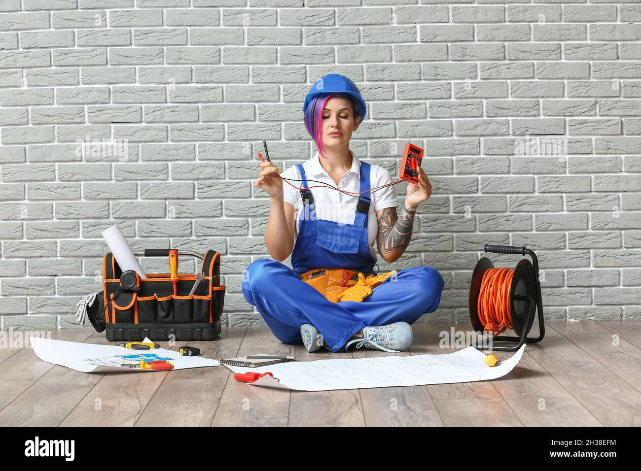 Young female electrician cables hi-res stock photography and images - Alamy