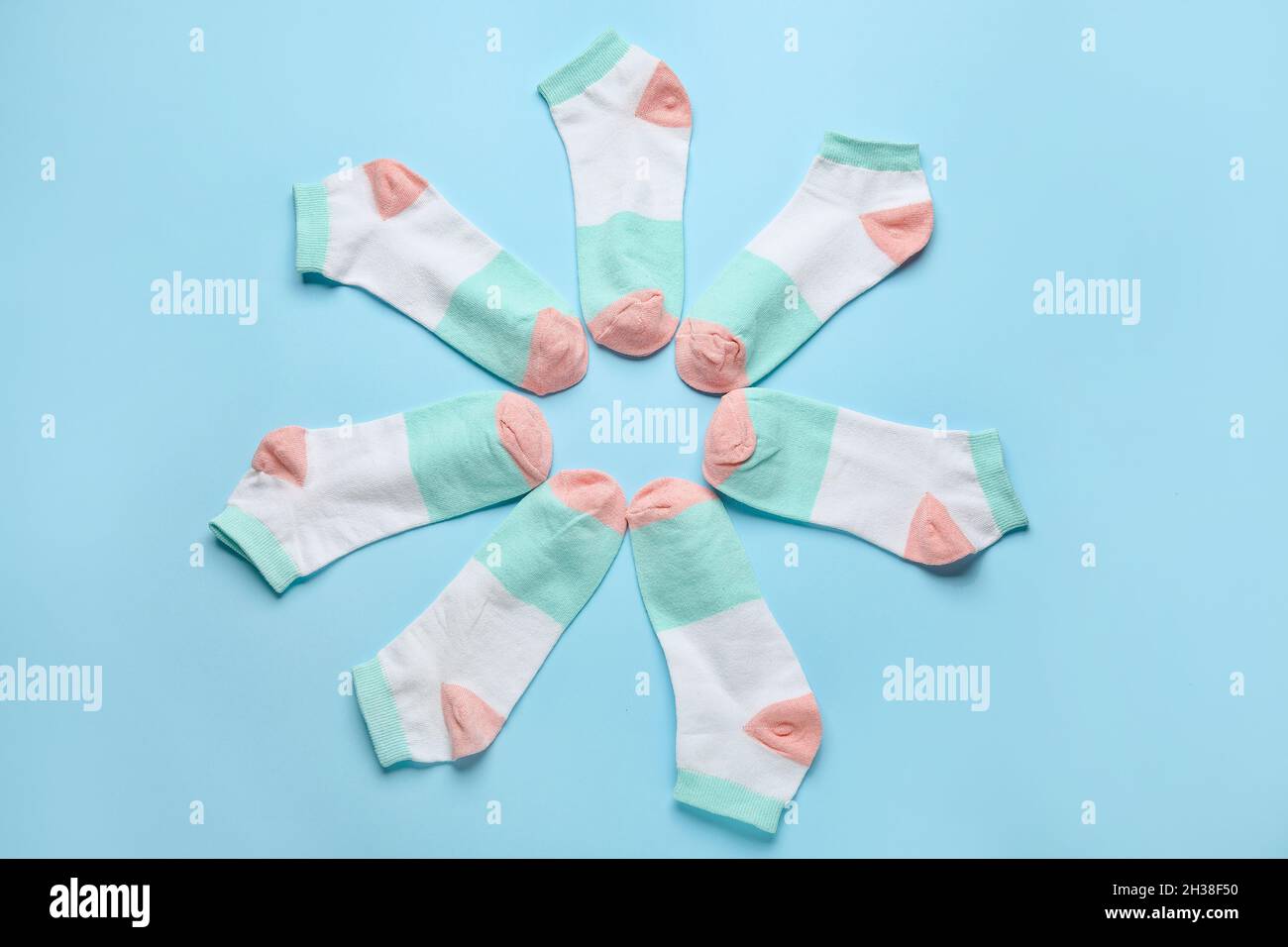 Frame made of socks on color background Stock Photo - Alamy