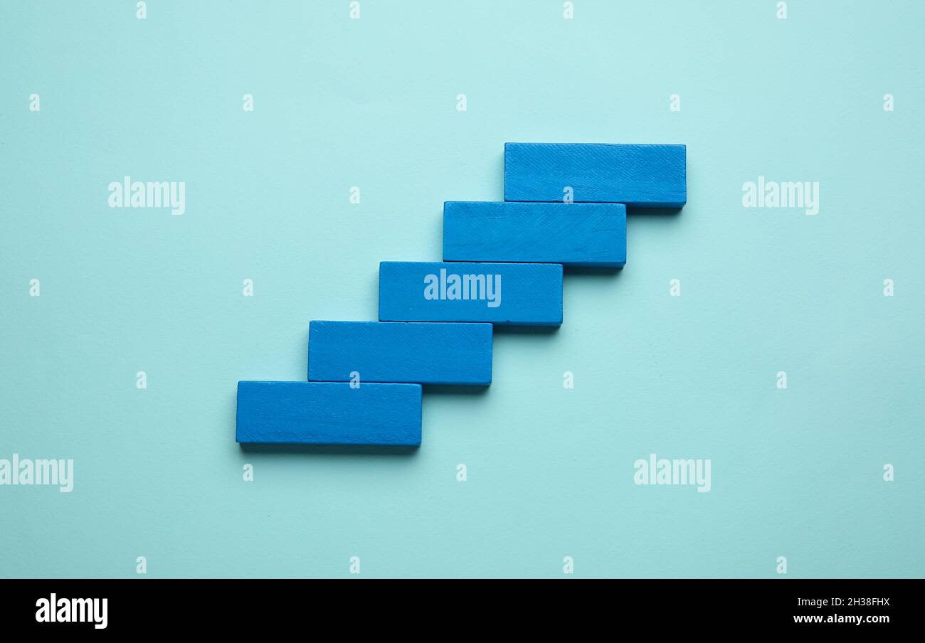 Blue blocks on color background Stock Photo - Alamy