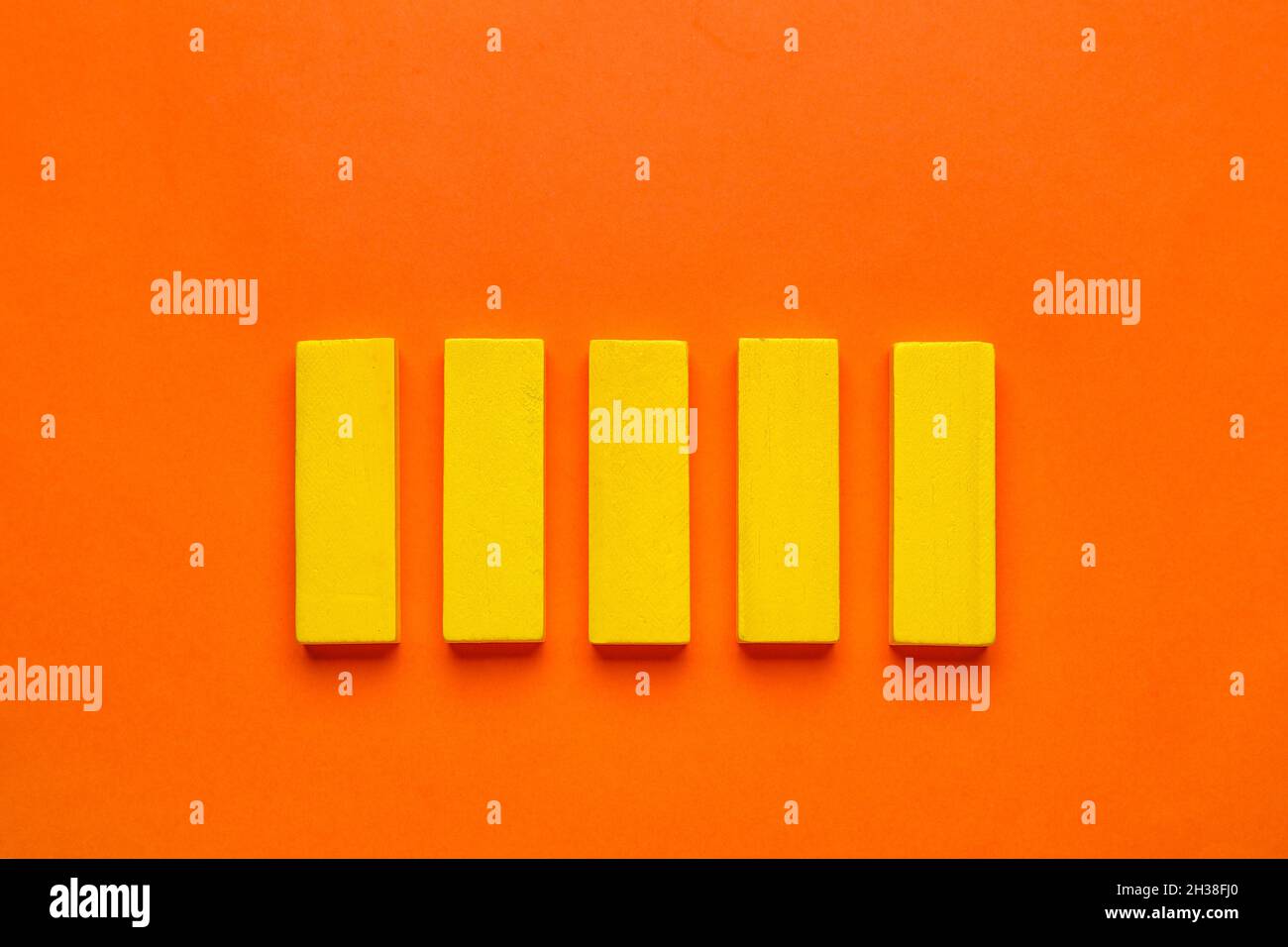 Yellow blocks on orange background Stock Photo - Alamy