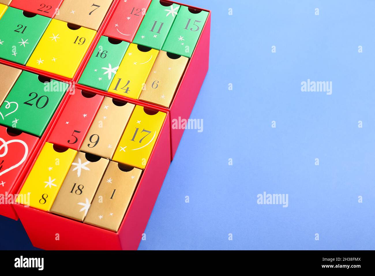 Winter advent calendar on blue background Stock Photo - Alamy