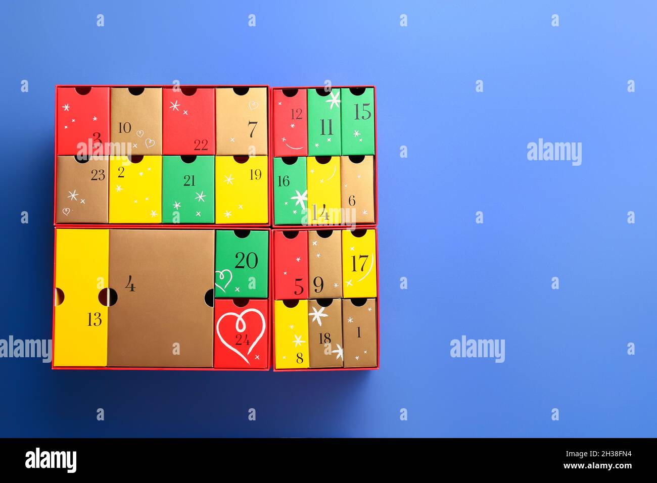 Winter advent calendar on blue background Stock Photo - Alamy
