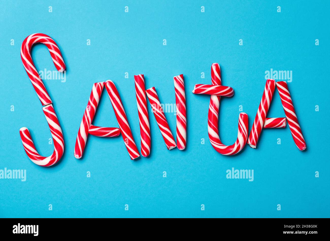 Word SANTA made of candy canes on color background Stock Photo - Alamy