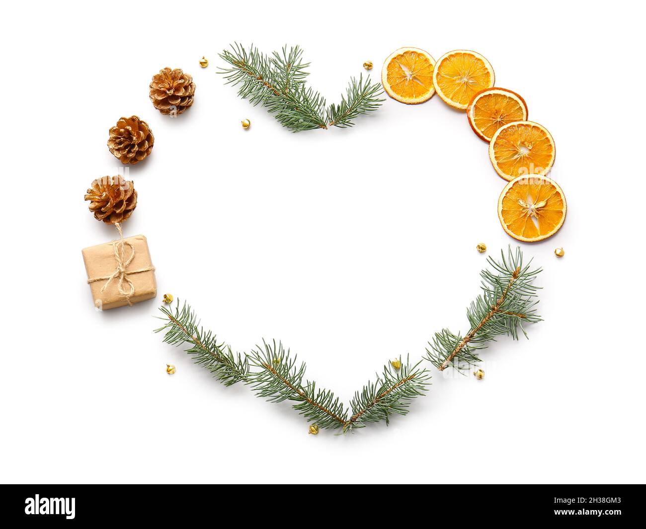 Heart made of coniferous branches, pine cones and dried orange slices ...