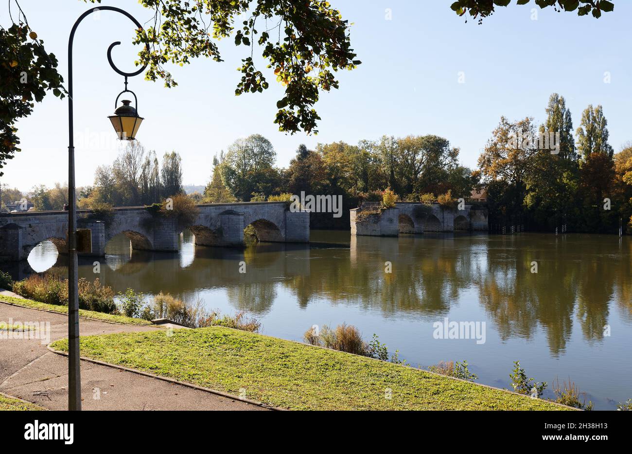 The old medieval broken arch bridge over the Seine river in Mantes-la ...