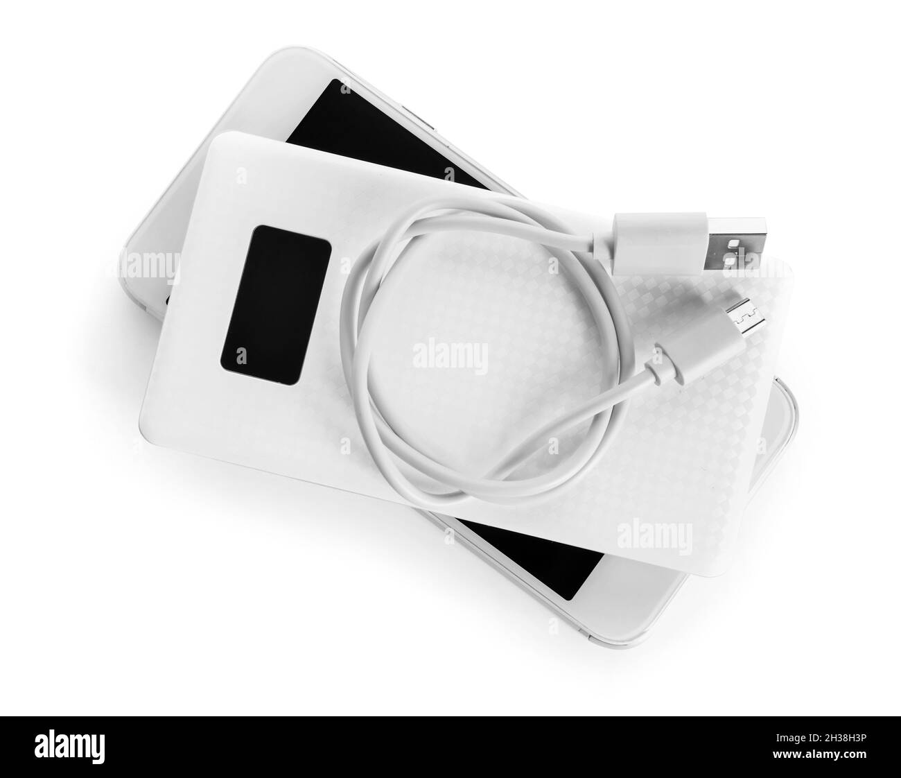 Modern power bank and mobile phone on white background Stock Photo - Alamy