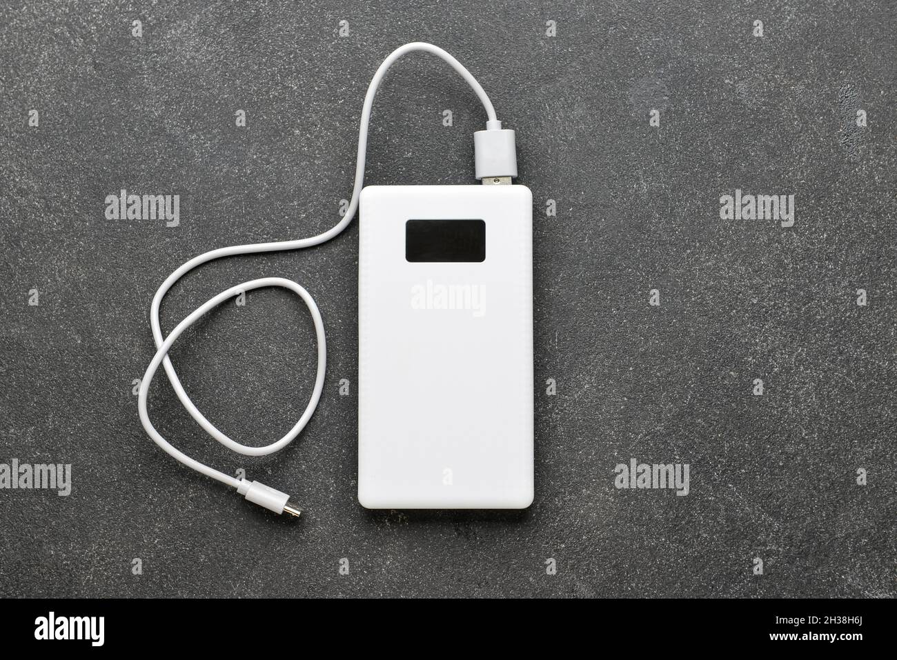 Modern power bank on black background Stock Photo - Alamy
