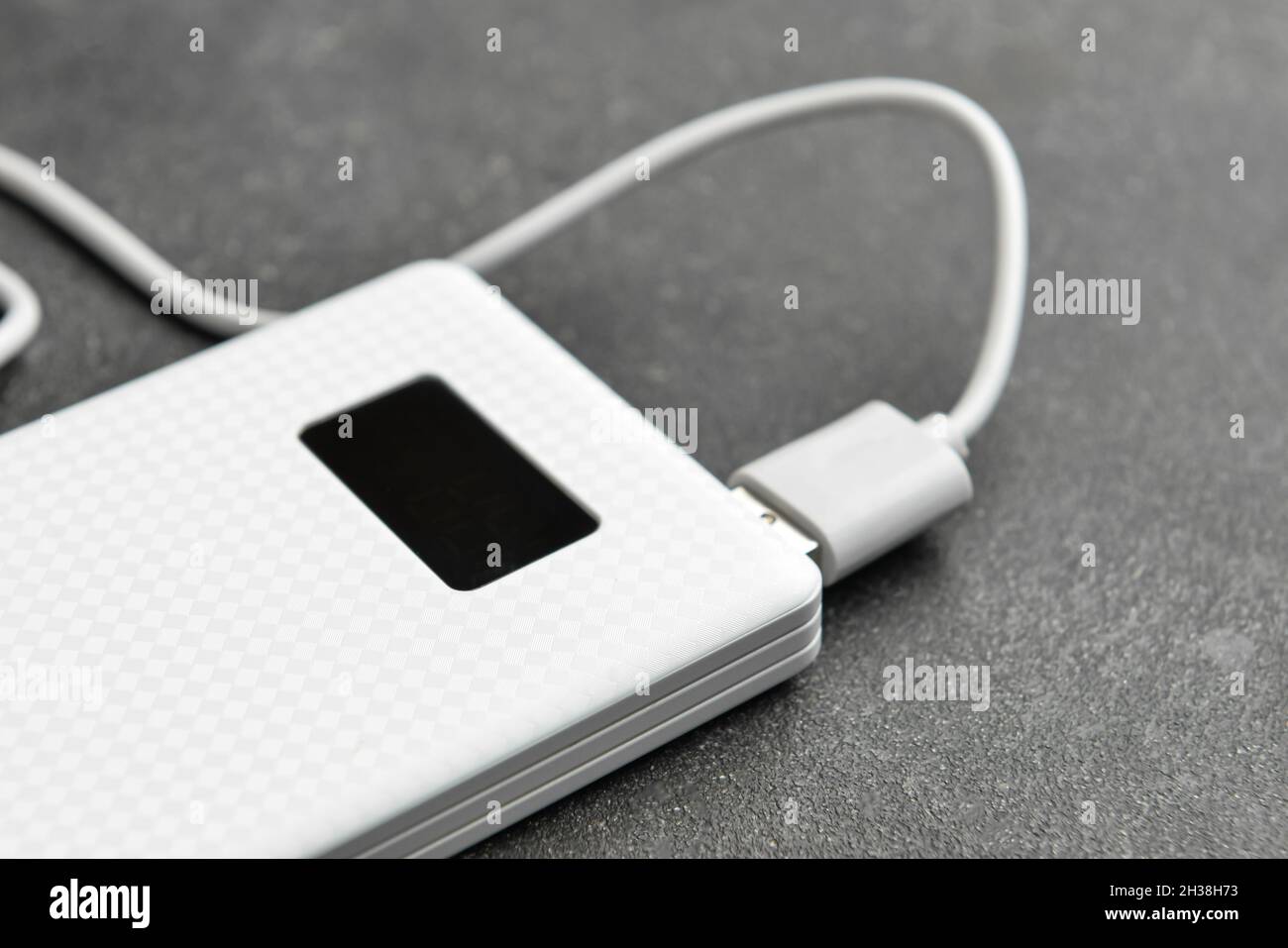 Modern power bank on black background, closeup Stock Photo - Alamy
