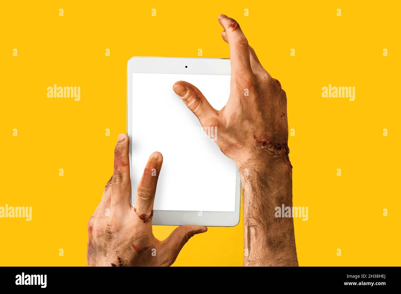 Hands of zombie with tablet computer on color background Stock Photo ...