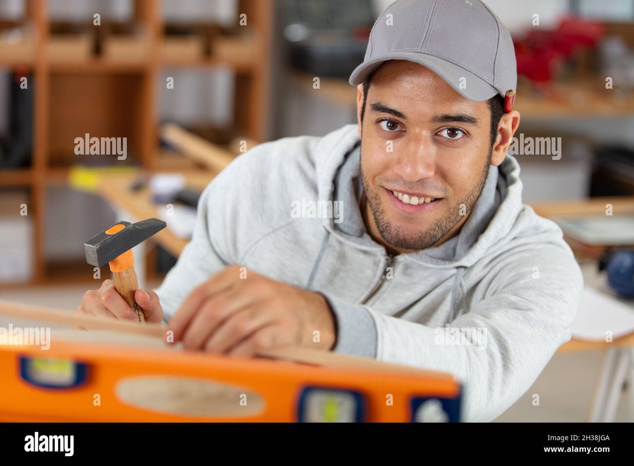 a young male carpenter builder Stock Photo - Alamy
