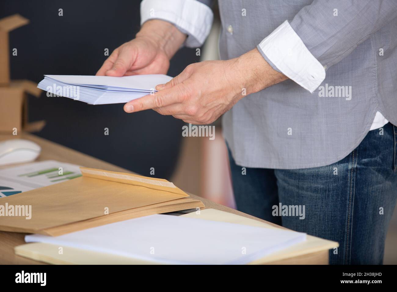portrait of hands with envelopes Stock Photo - Alamy