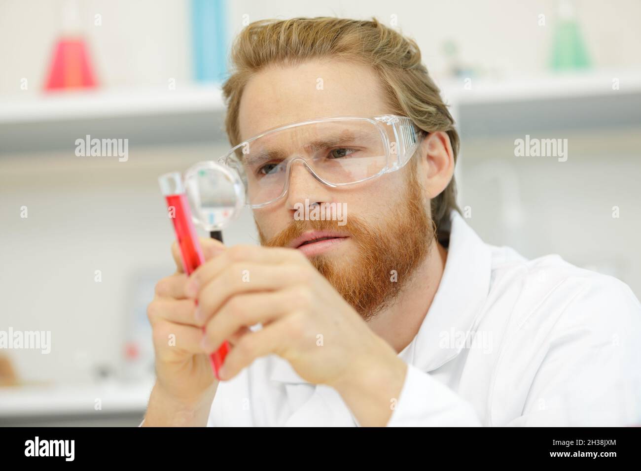 Doctor checking blood samples hi-res stock photography and images - Alamy