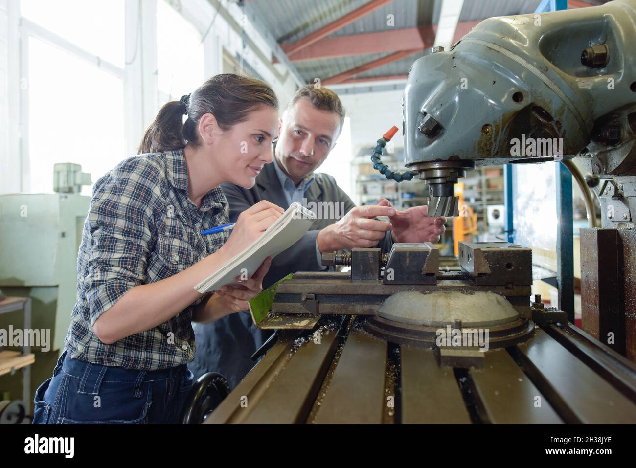 beautiful young lathe company female leader control drilling machine ...