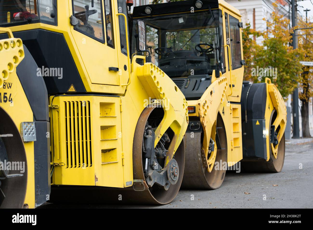 Close up picture of construction device, yellow stamp Stock Photo - Alamy