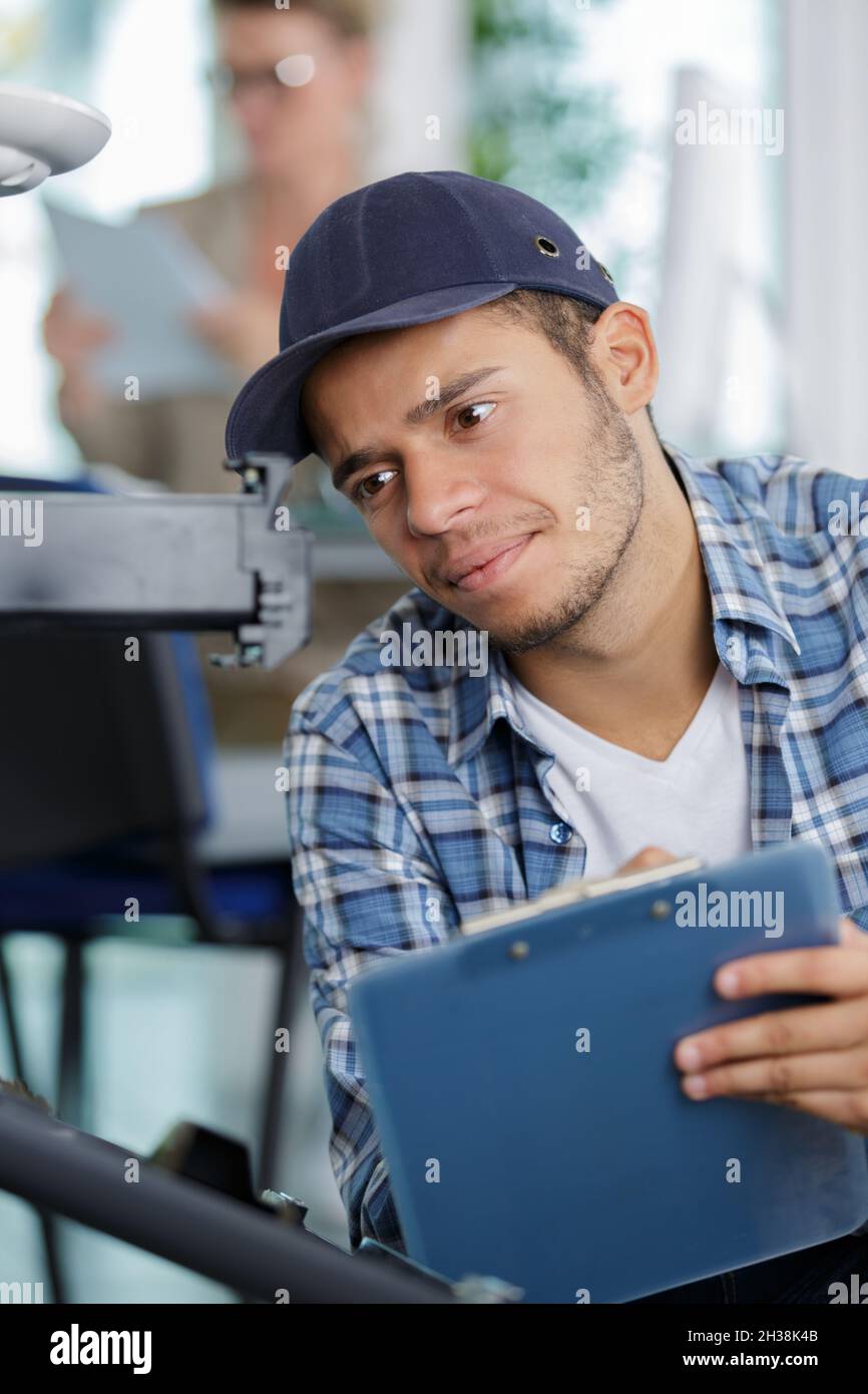 a technician man monitoring something Stock Photo - Alamy
