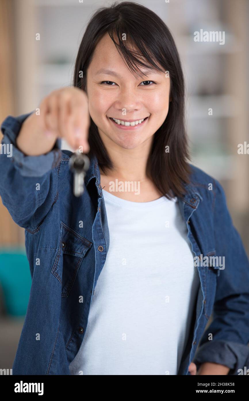 young asian woman holding a set of keys Stock Photo - Alamy