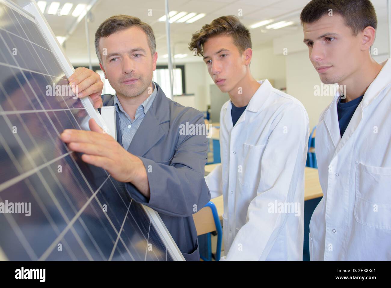 male engineer touching a solar panel Stock Photo - Alamy