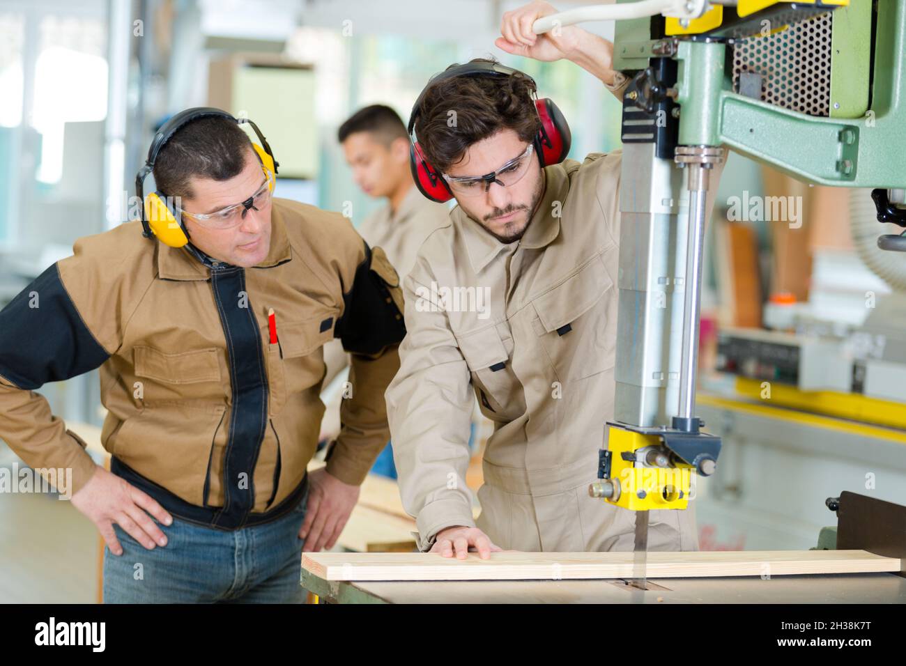 male operator using a milling machine for cutting wood Stock Photo - Alamy