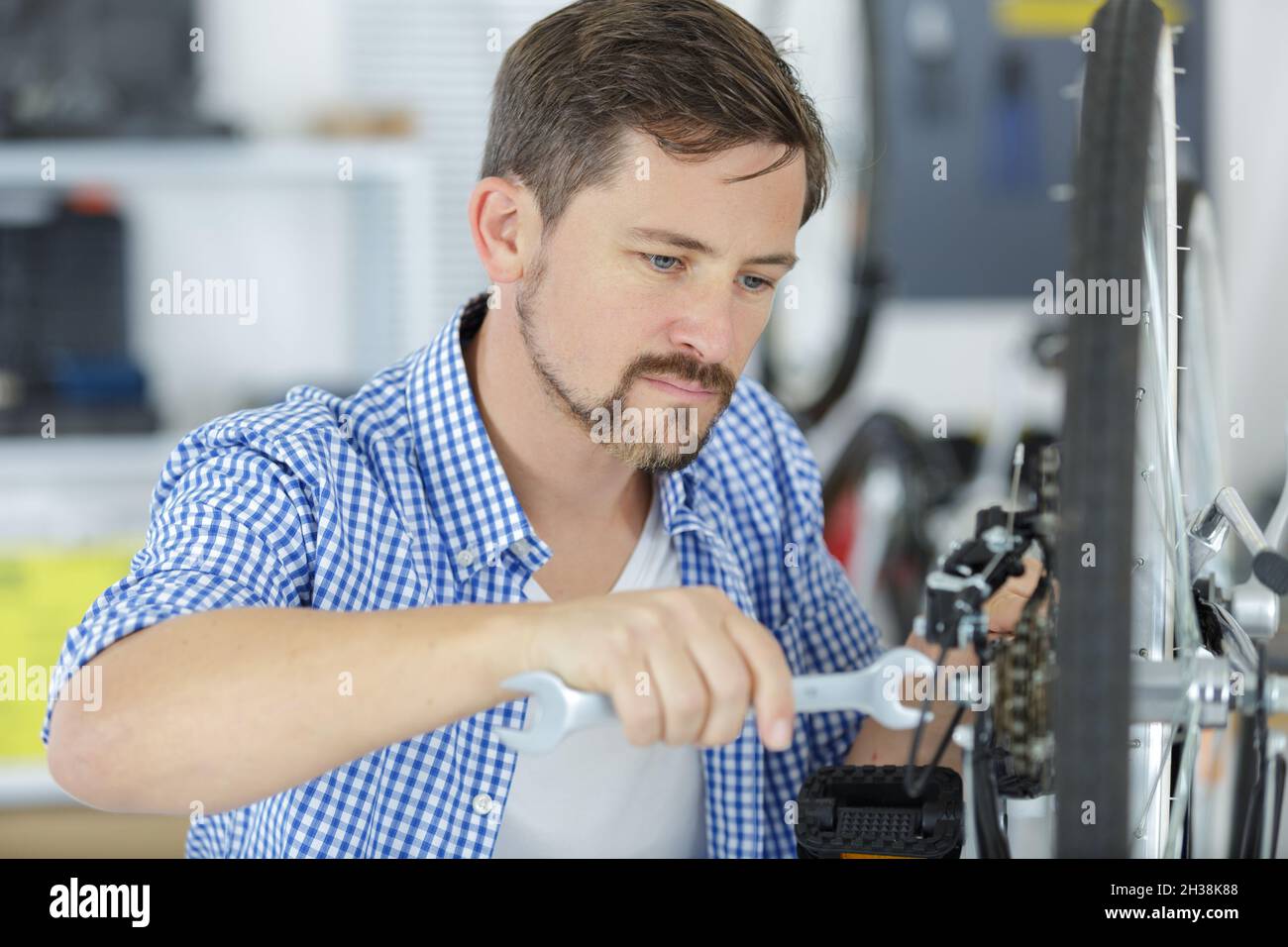 Worker repairing bicycles in hi-res stock photography and images - Alamy