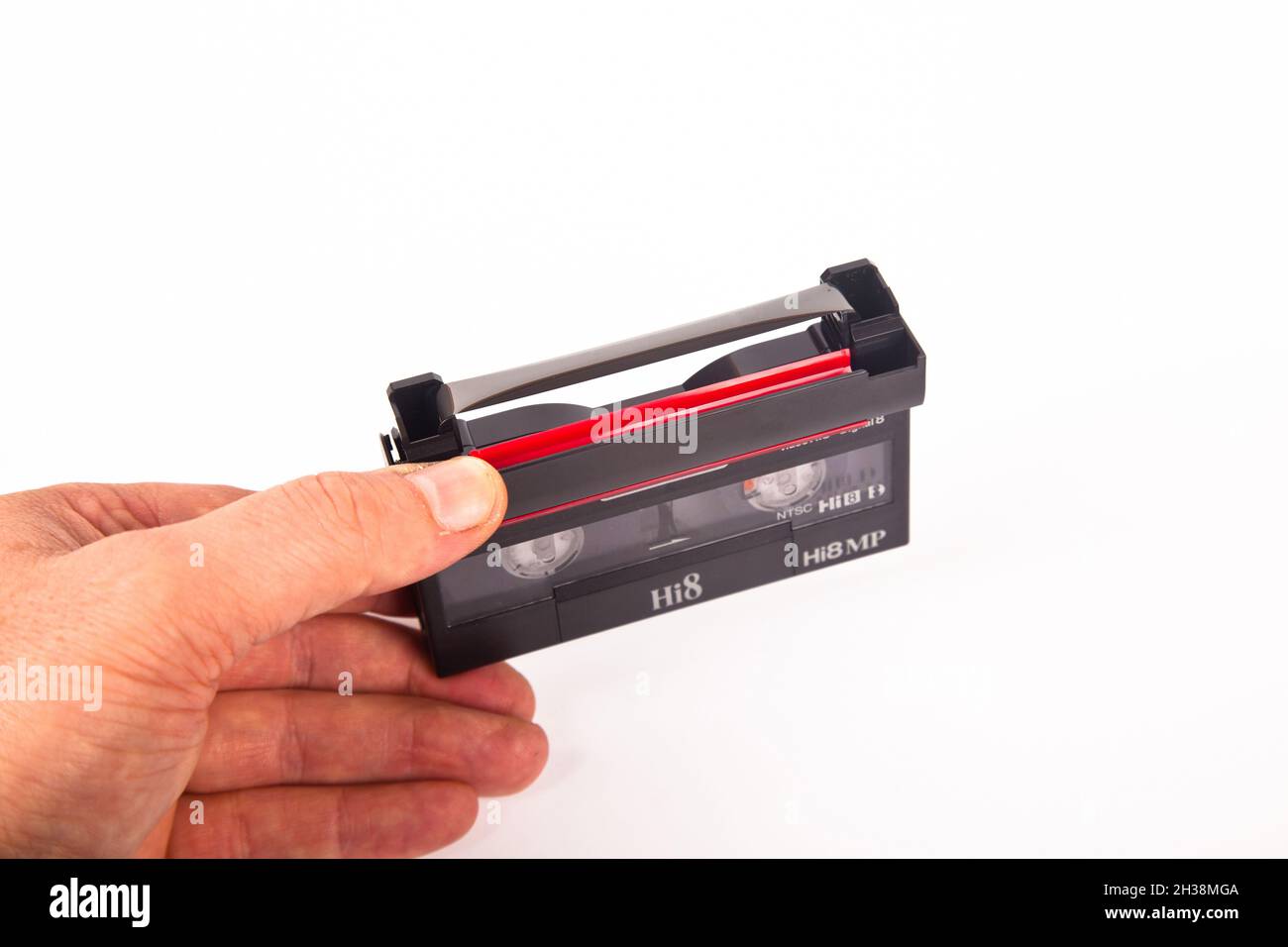 Small old black MiniDV format video cassette, isolated on white ...