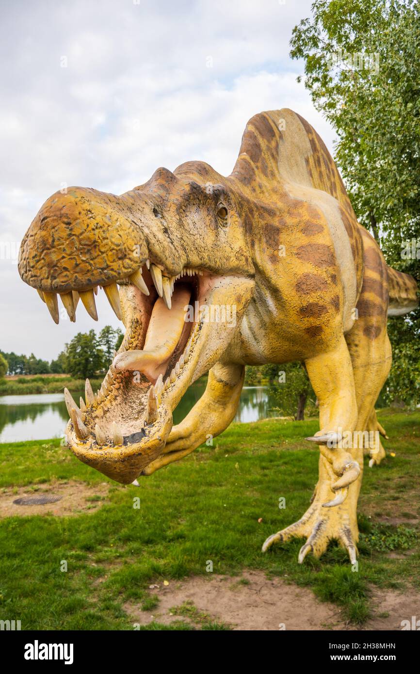 ROGOWO, POLAND - Sep 26, 2021: A vertical shot of spinosaurus sculpture ...