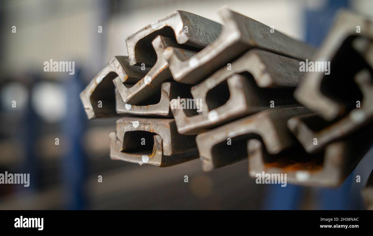 Closeup of shaped cross-section industrial materials with blurred ...