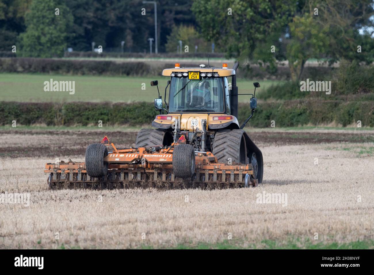 Farmer using a Challenger Agricultural Crawler tractor and pulling a 5 ...