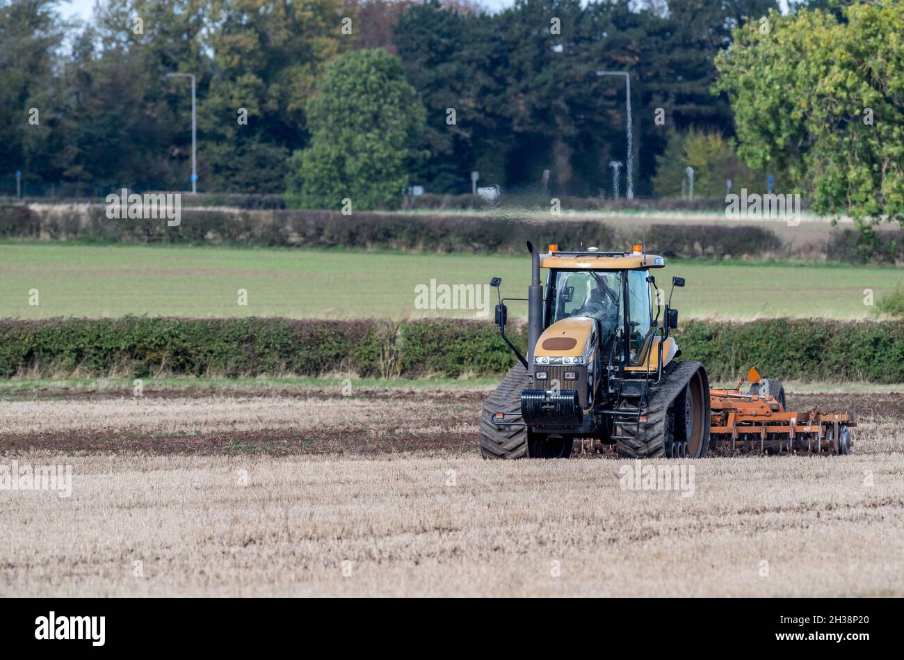 Farmer using a Challenger Agricultural Crawler tractor and pulling a 5 ...