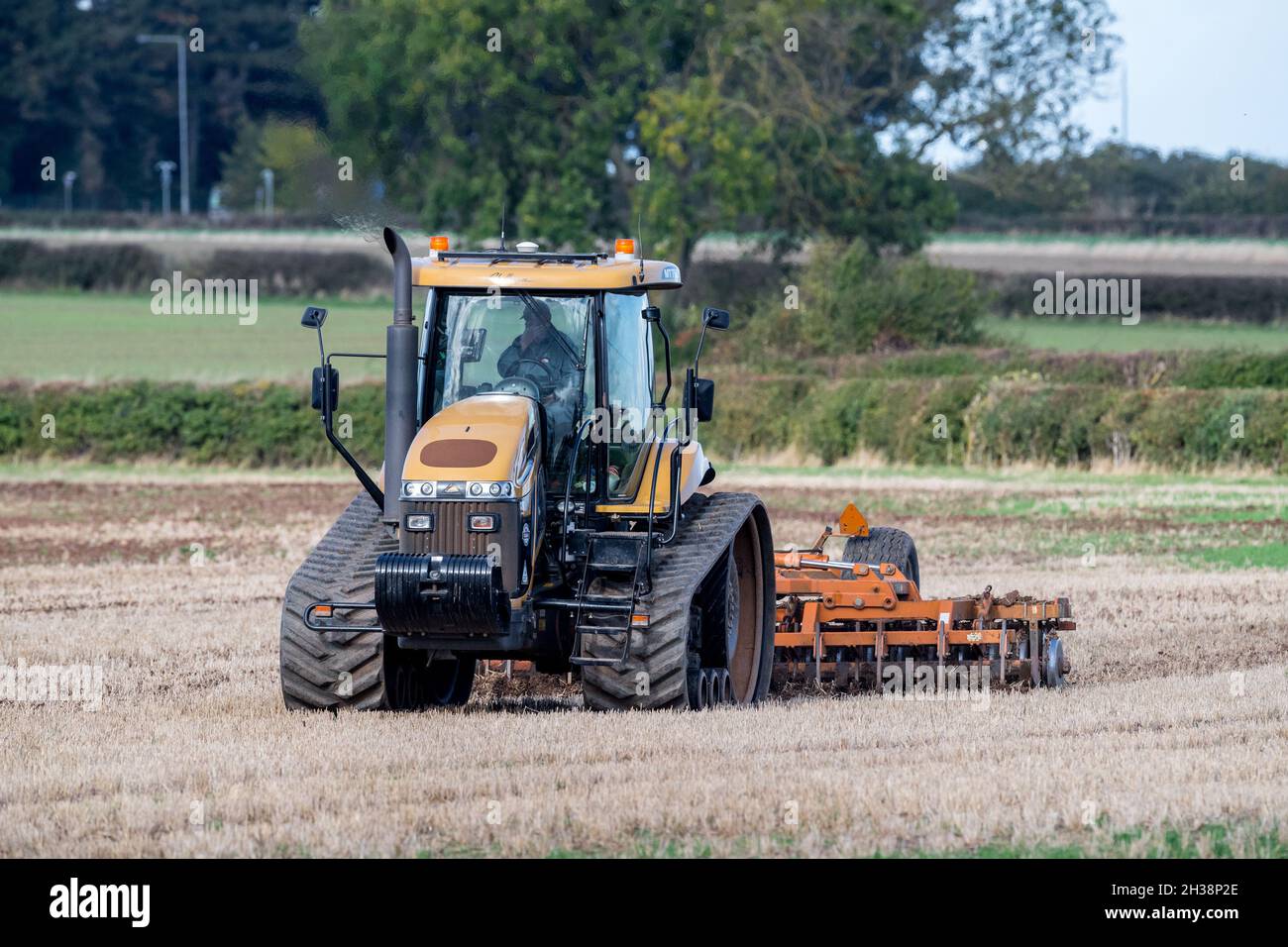 Farmer using a Challenger Agricultural Crawler tractor and pulling a 5 ...