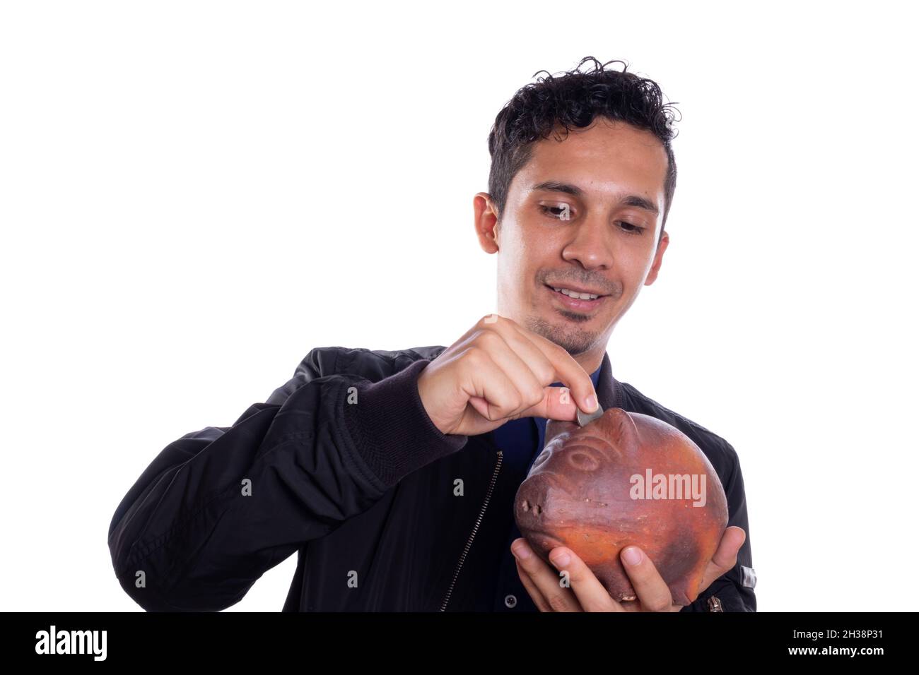 Man throwing coin to piggy bank. White background. Happy and smiling ...